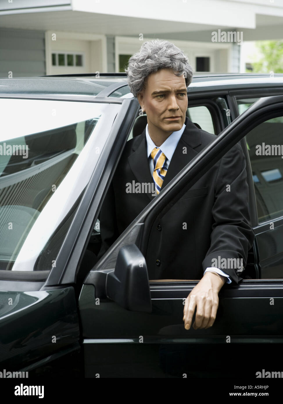 Mannequin standing beside a car Stock Photo - Alamy