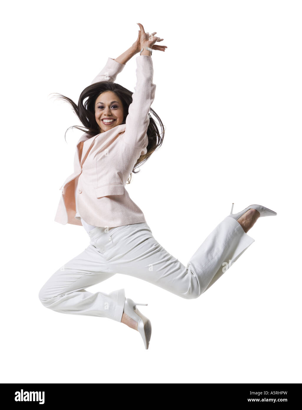 Portrait of a young woman jumping Stock Photo - Alamy
