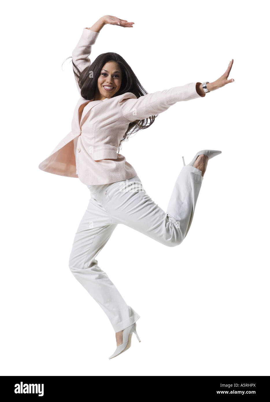 Portrait of a young woman jumping Stock Photo - Alamy