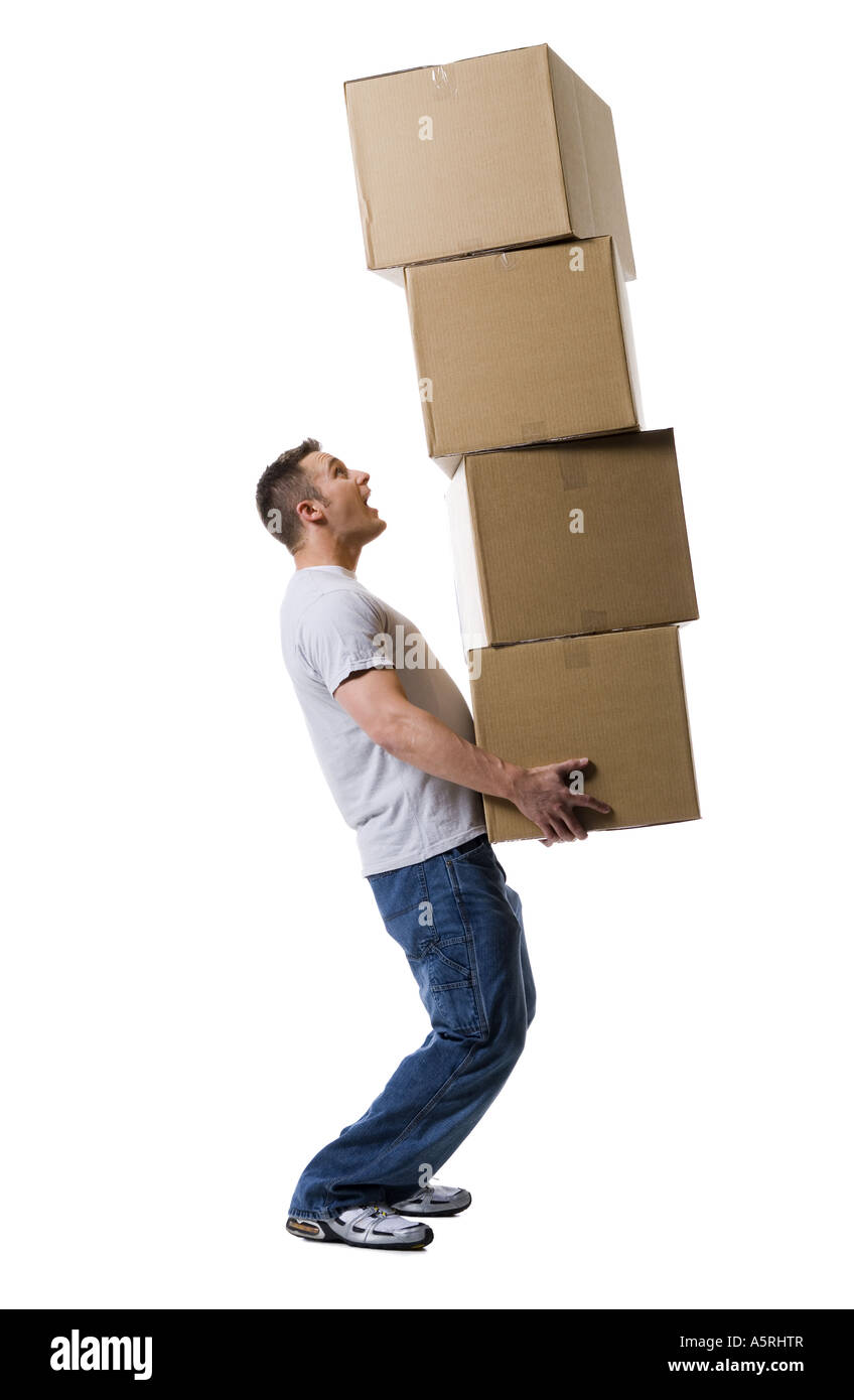 Profile of a young man holding a stack of cardboard boxes Stock Photo ...