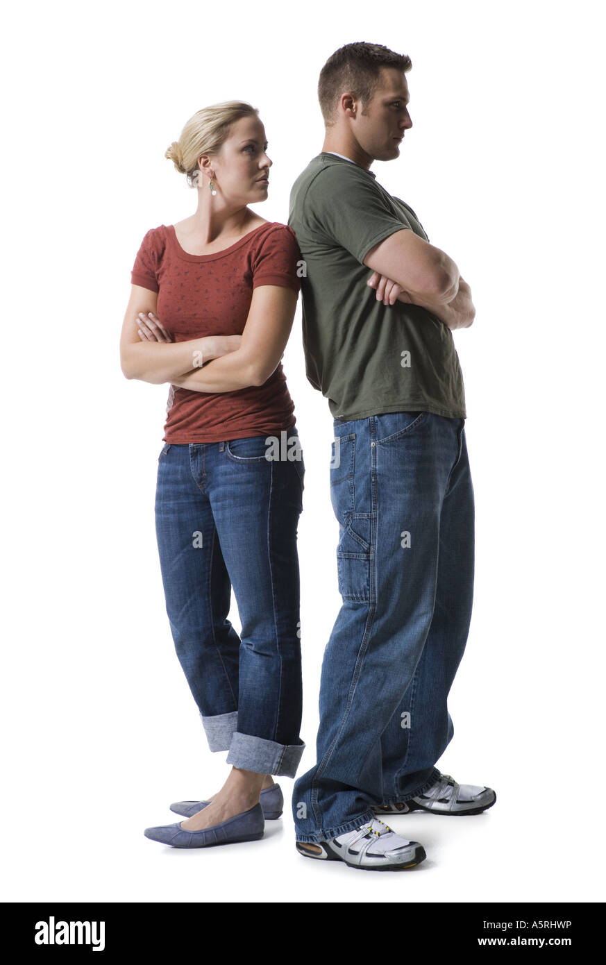 Profile of a young couple standing back to back Stock Photo - Alamy