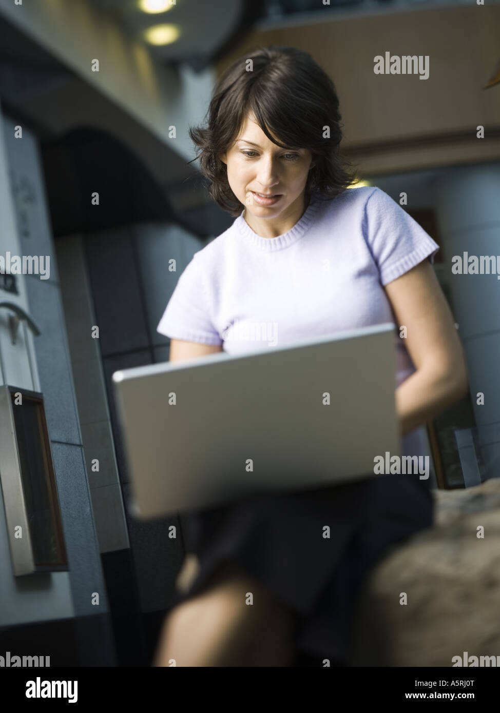 Woman using a laptop Stock Photo - Alamy