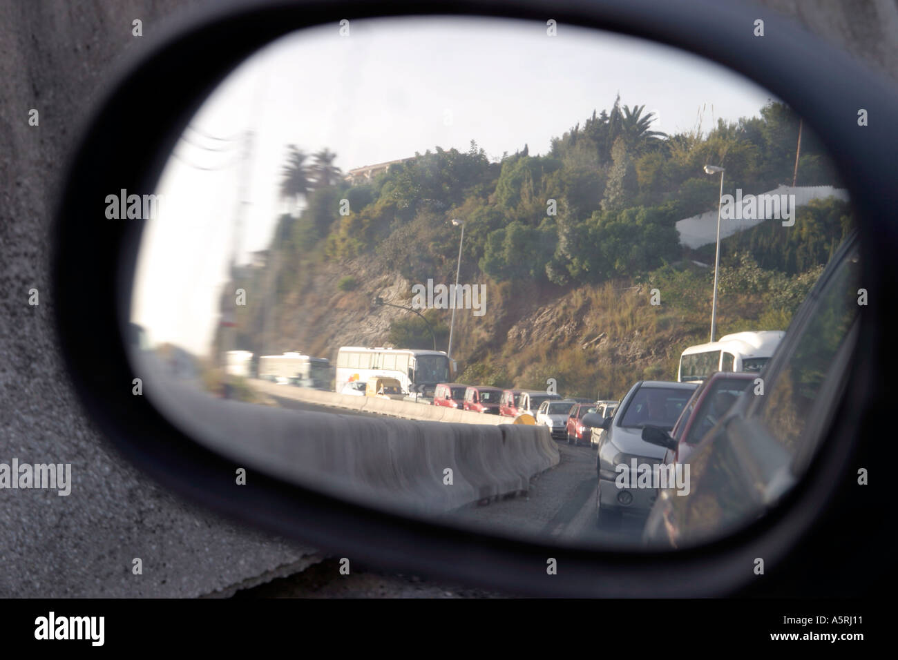 Traffic tailback seen in rear vision mirror Stock Photo - Alamy