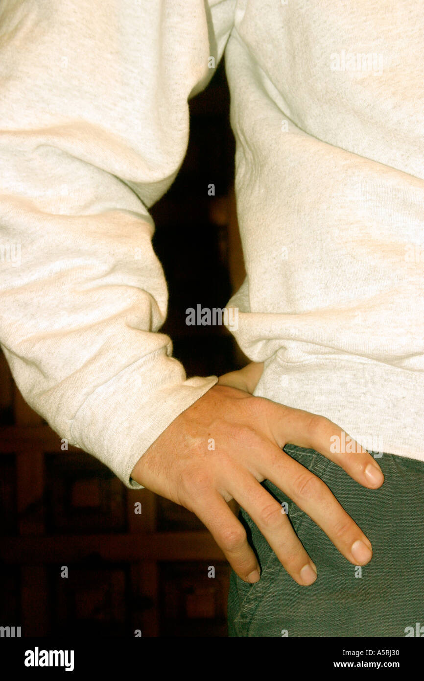 Man with hand on hip Stock Photo - Alamy