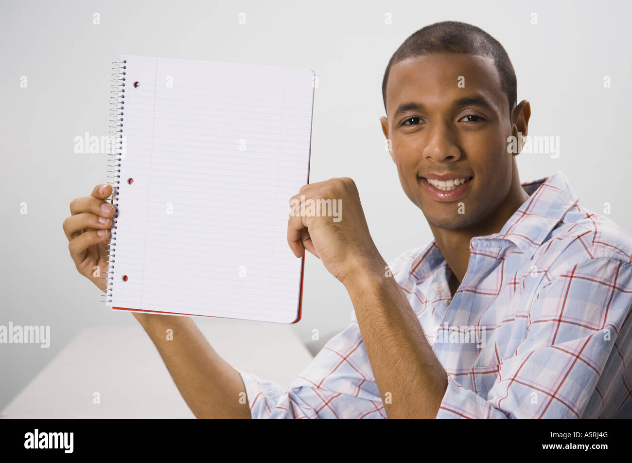 African American male student holding blank workbook Stock Photo - Alamy African American male student holding blank workbook Stock Photo - Alamy