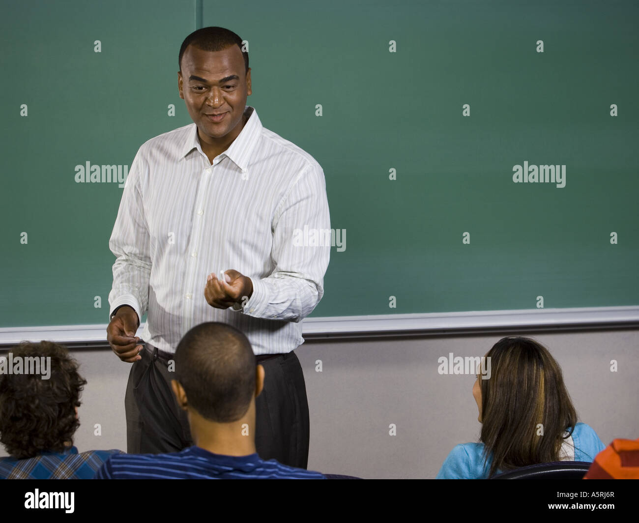 College teacher giving a lesson in classroom Stock Photo - Alamy