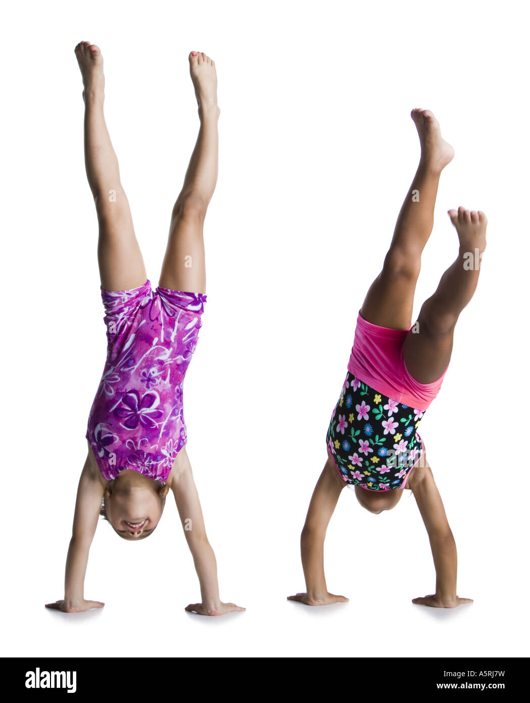 Young female gymnasts doing handstands Stock Photo - Alamy