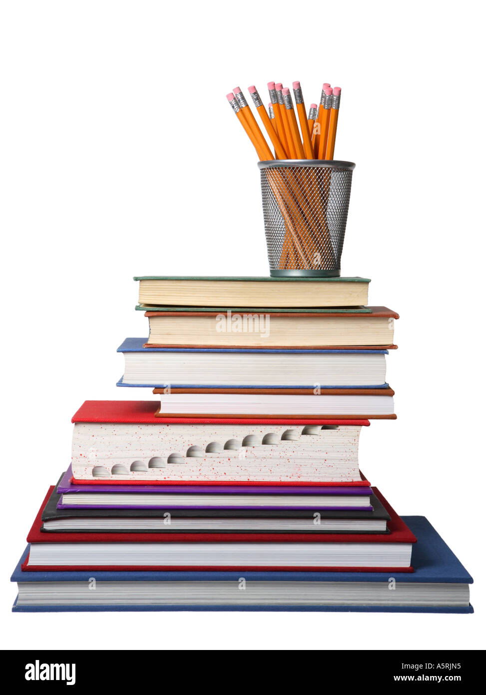 Stack of school books with pencil holder on top Stock Photo - Alamy
