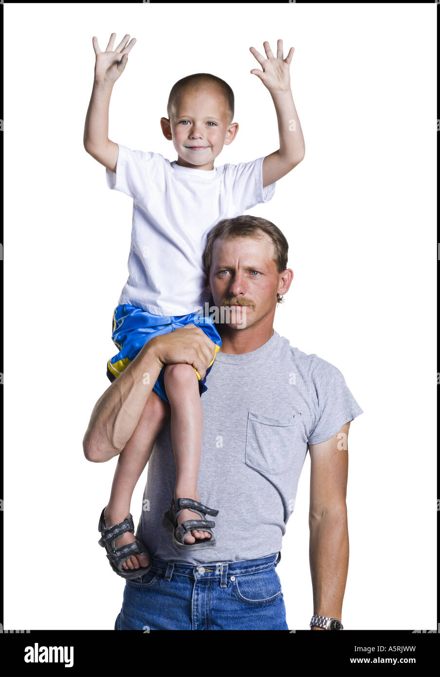 Father with son sitting on shoulder Stock Photo - Alamy