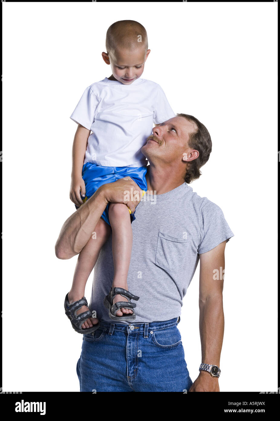 Father with son sitting on shoulder Stock Photo - Alamy