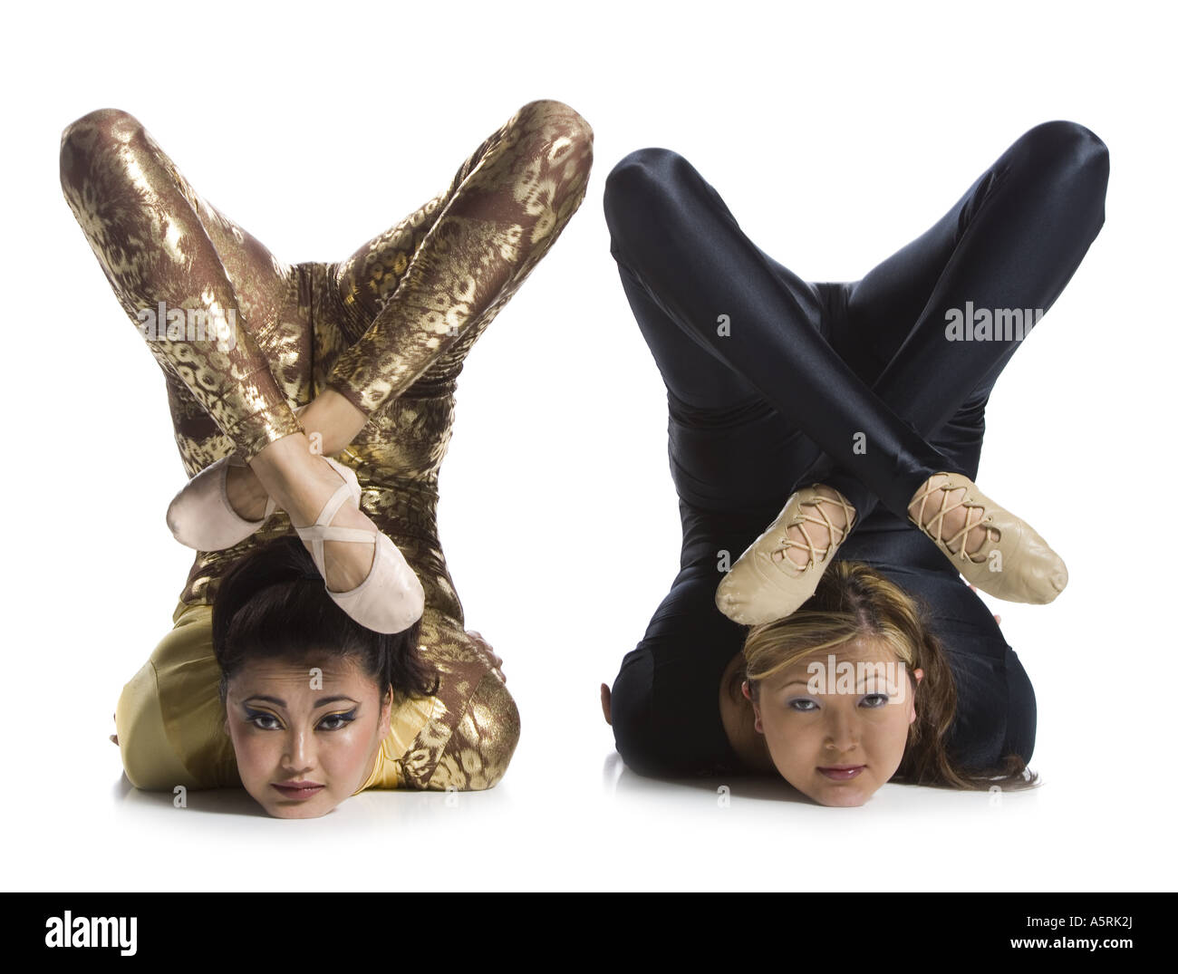 Female contortionist duo performing Stock Photo - Alamy