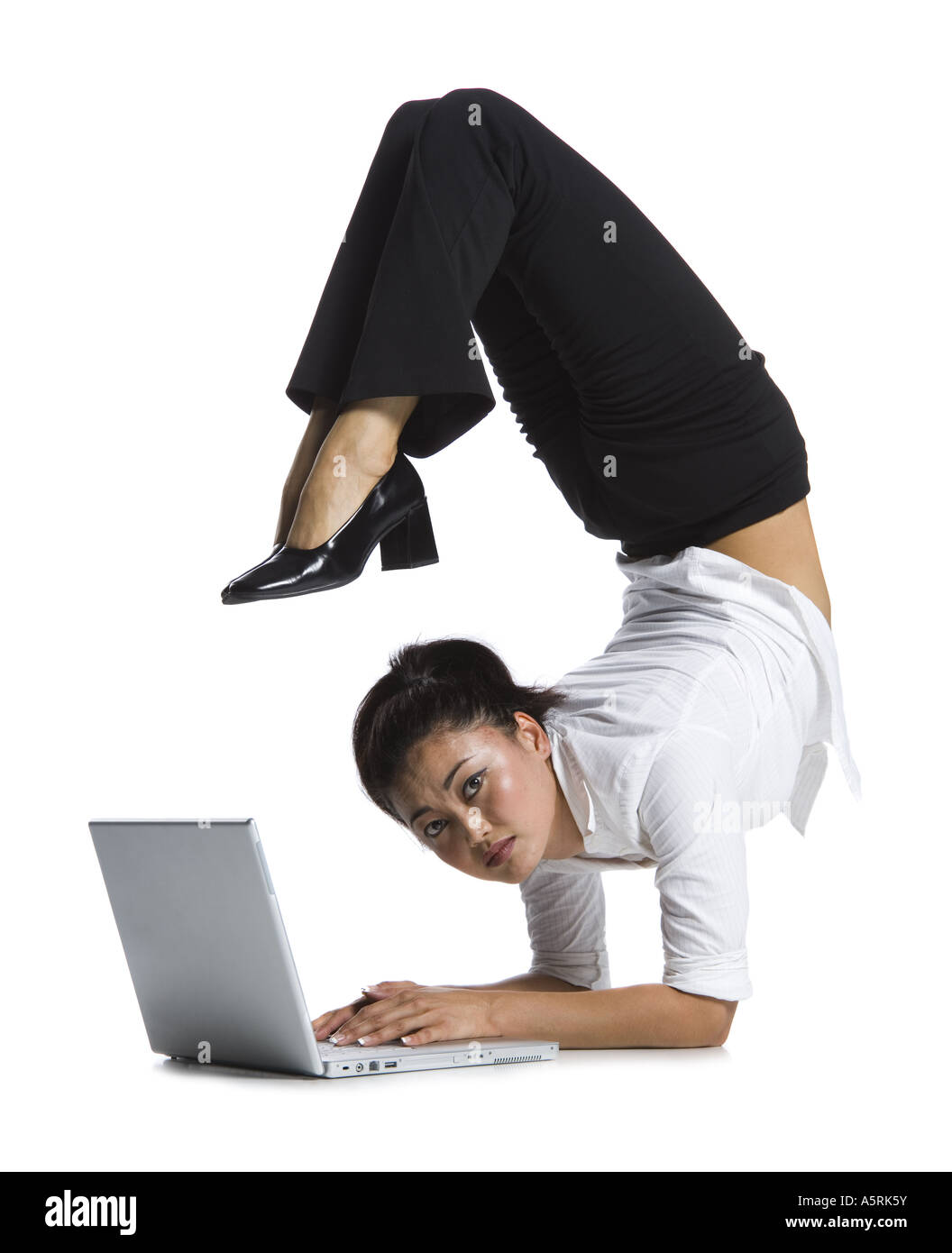 Female contortionist businesswoman Stock Photo - Alamy