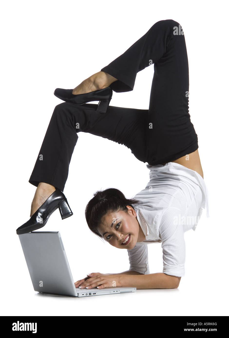 Female contortionist businesswoman Stock Photo - Alamy