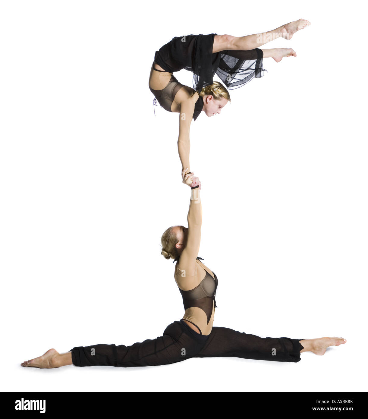 Female contortionist duo performing Stock Photo - Alamy