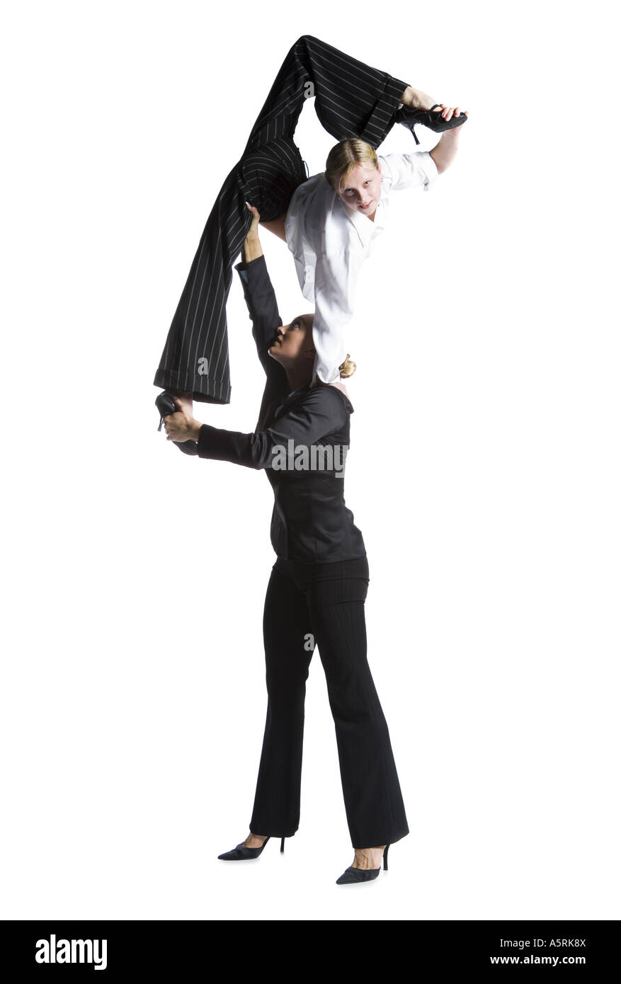 Two female contortionist businesswomen hi-res stock photography and ...
