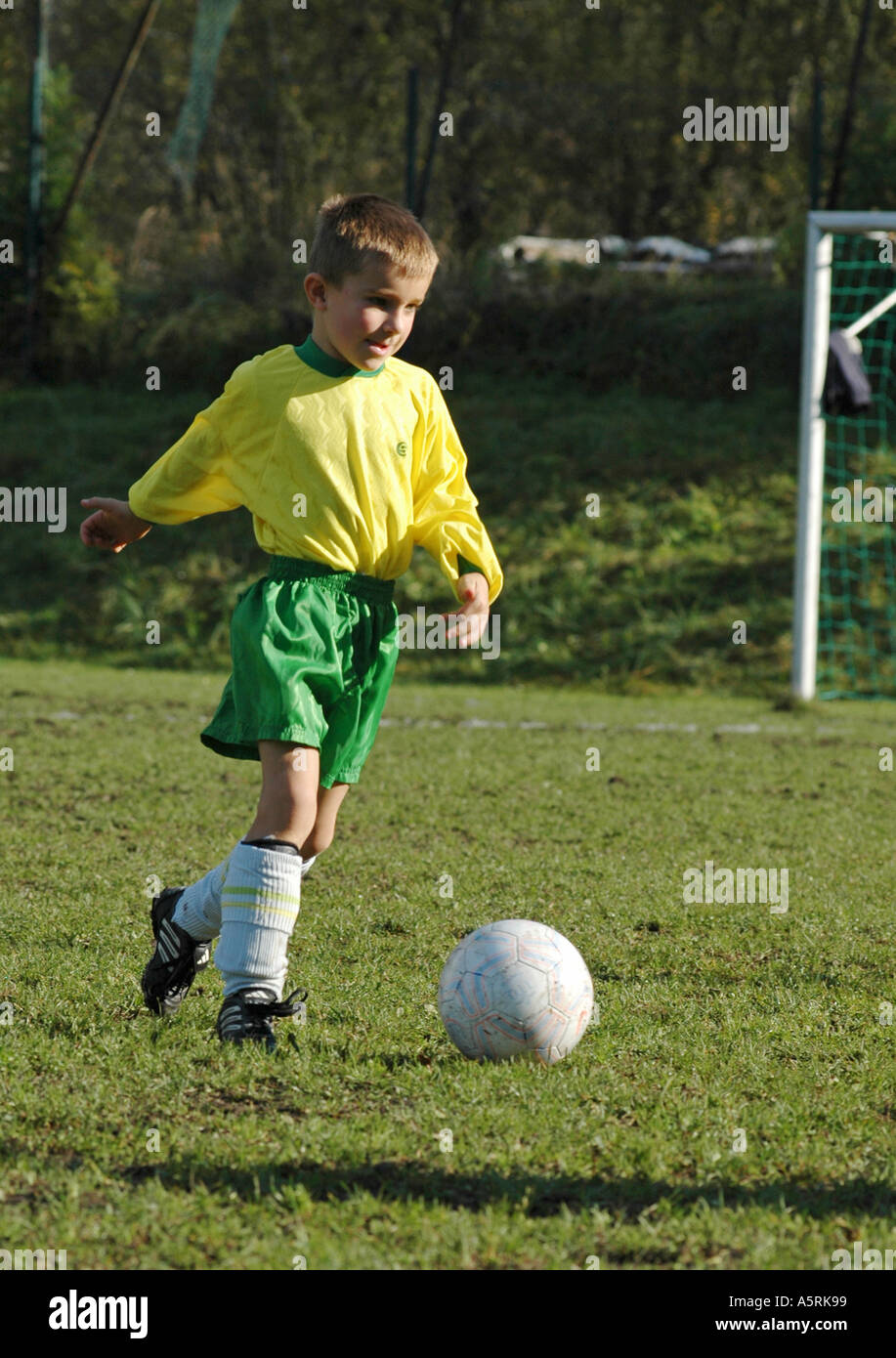 MR boy 6 years old is playing soccer ball Stock Photo - Alamy