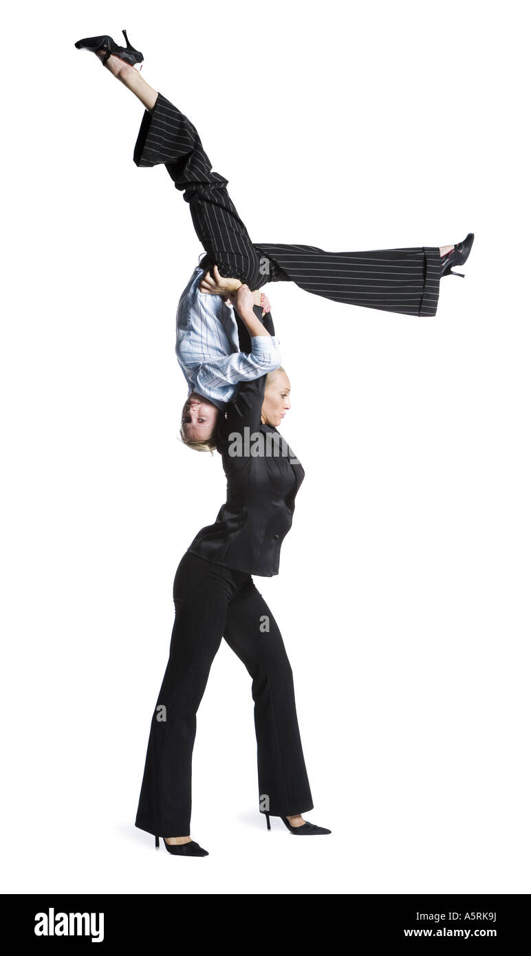 Two female contortionist businesswomen hi-res stock photography and ...