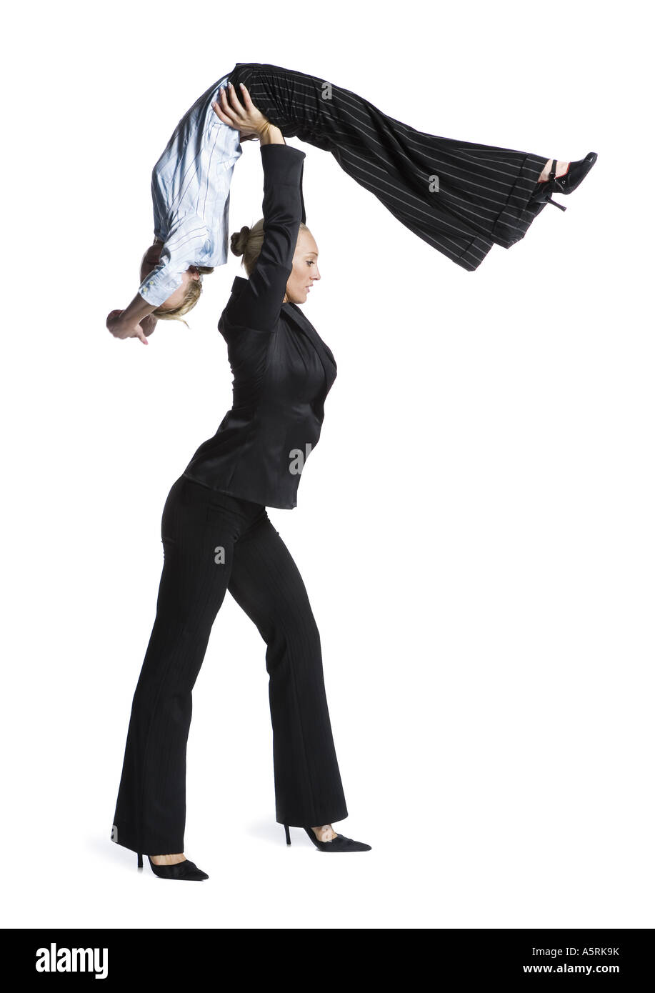 Two female contortionist businesswomen hi-res stock photography and ...