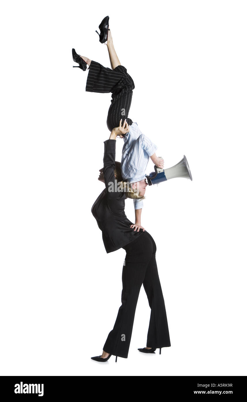 Two female contortionist businesswomen hi-res stock photography and ...