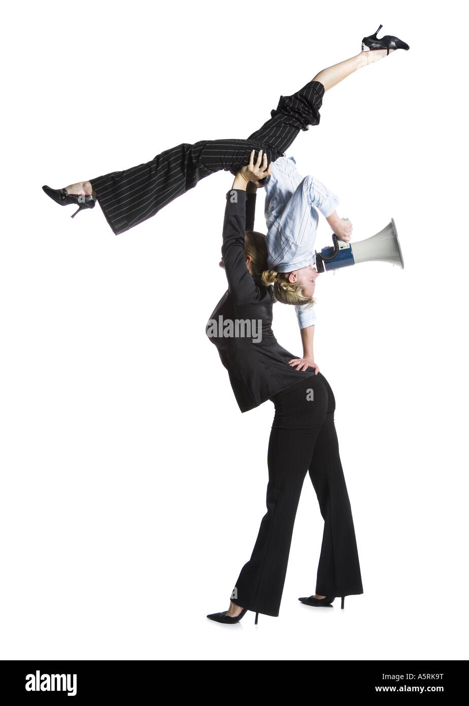 Two female contortionist businesswomen hi-res stock photography and ...
