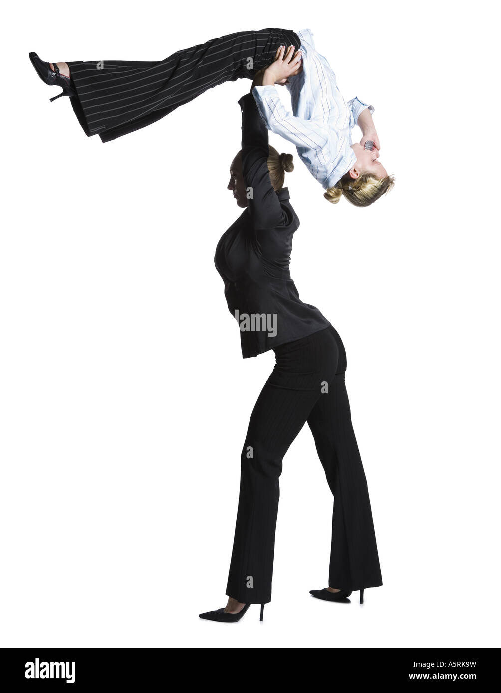 Two female contortionist businesswomen hi-res stock photography and ...