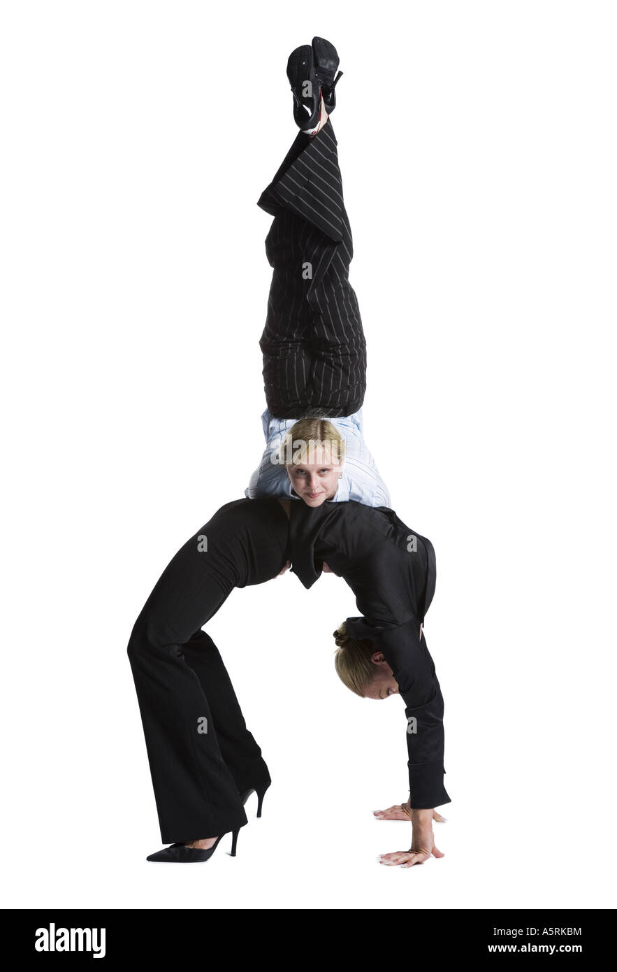 Two female contortionist businesswomen hi-res stock photography and ...