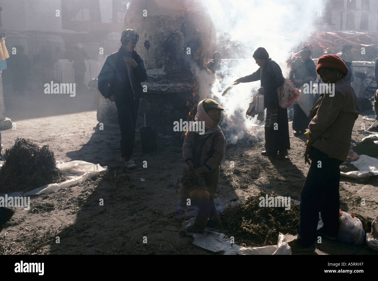 PILGRIMS BURNING JUNIPER LEAVES OUTSIDE THE JOKHANG TEMPLE FOR GOOD ...