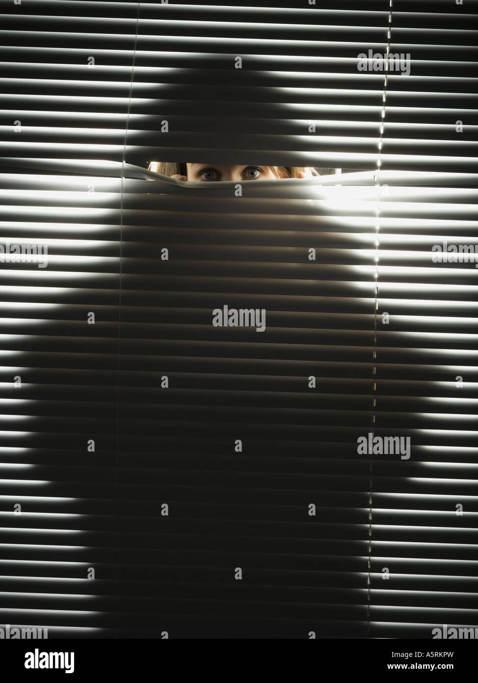 Peeping through blinds hi-res stock photography and images - Alamy