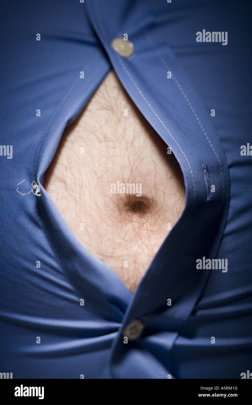 Close up of fat stomach bursting through shirt Stock Photo - Alamy