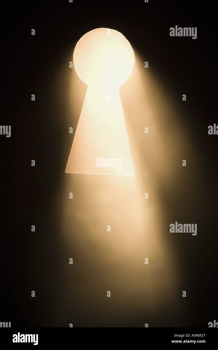 Keyhole with bright light beaming through Stock Photo - Alamy