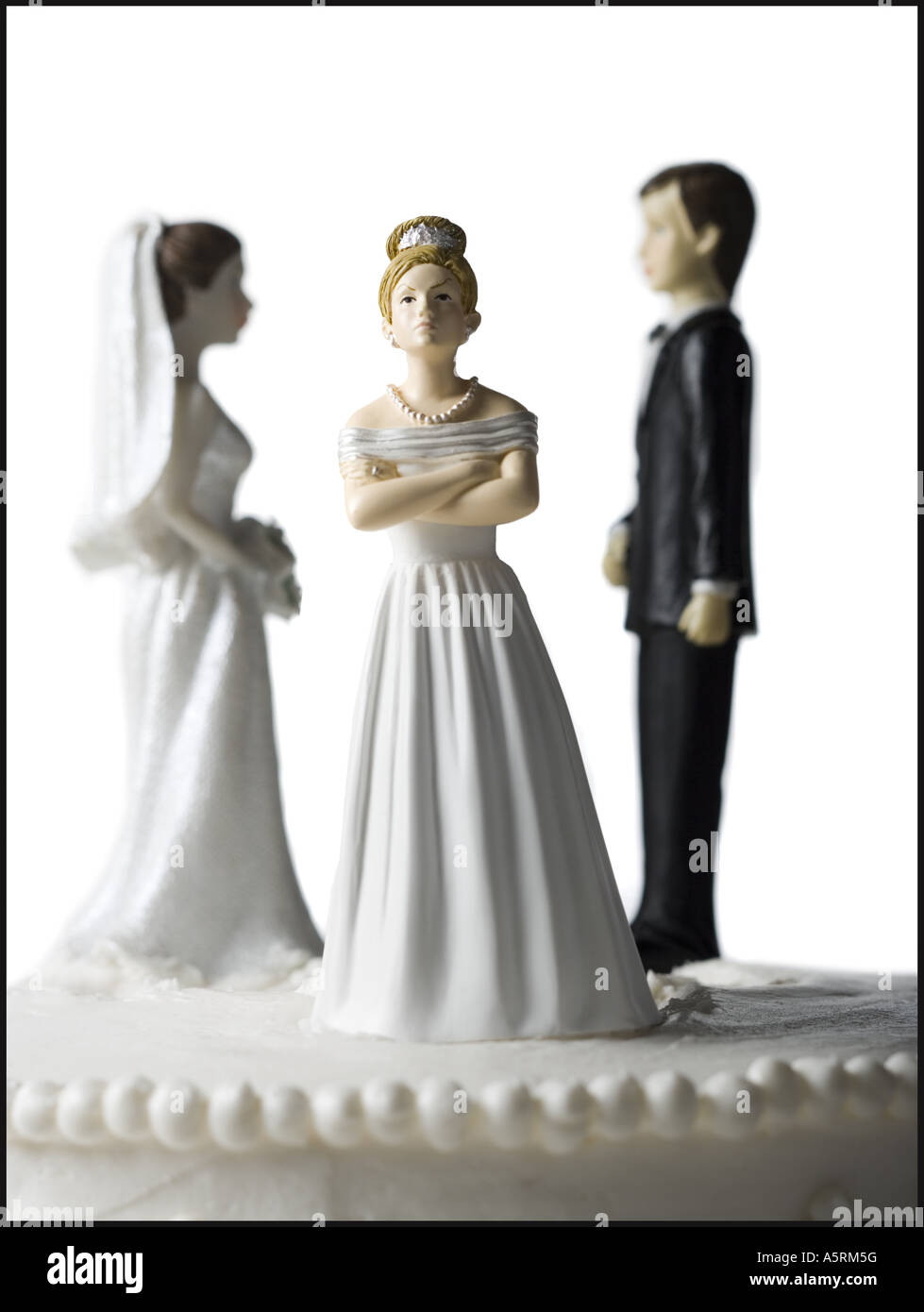 Wedding cake visual metaphor with figurine cake toppers Stock Photo - Alamy