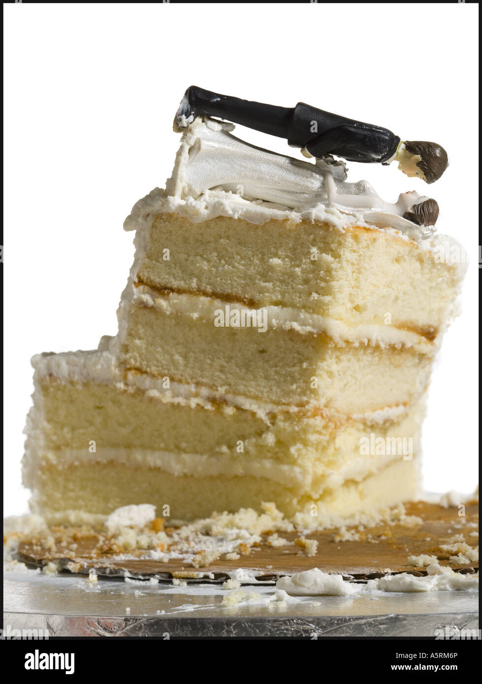 Wedding cake visual metaphor with figurine cake toppers Stock Photo - Alamy