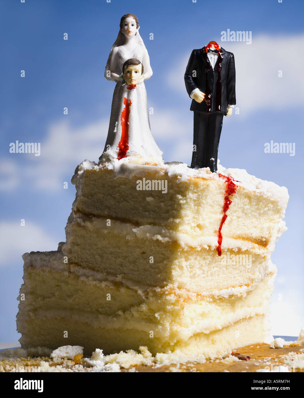 Wedding cake visual metaphor with figurine cake toppers Stock Photo - Alamy