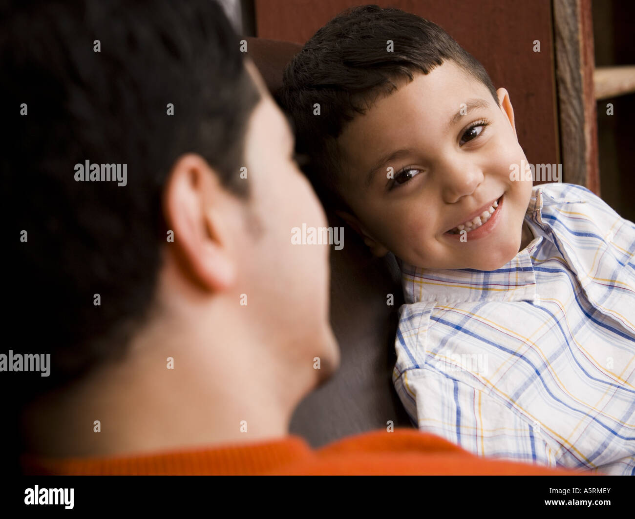 Father and young son talking Stock Photo - Alamy