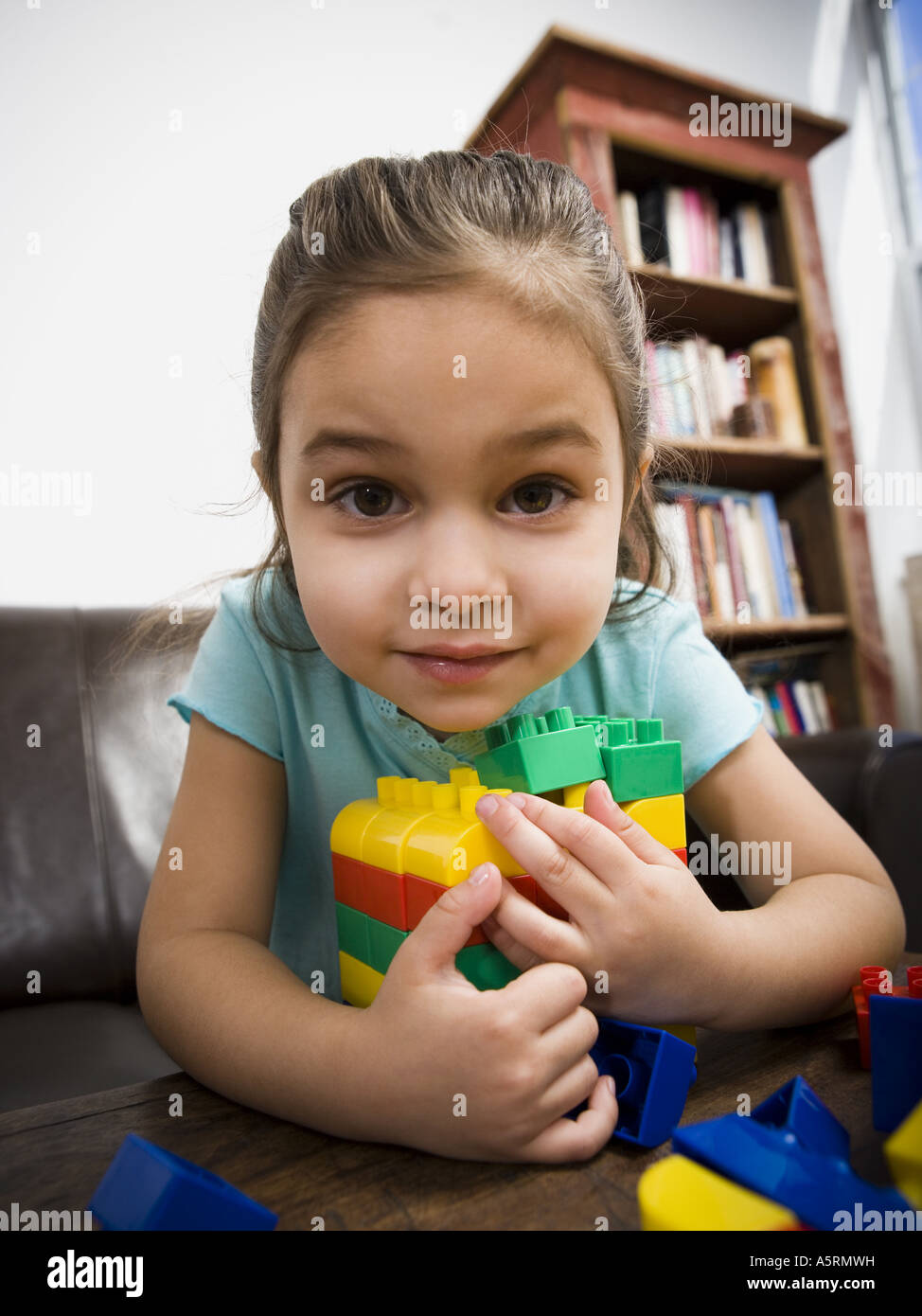 Mother and young daughter playing with building blocks Stock Photo - Alamy