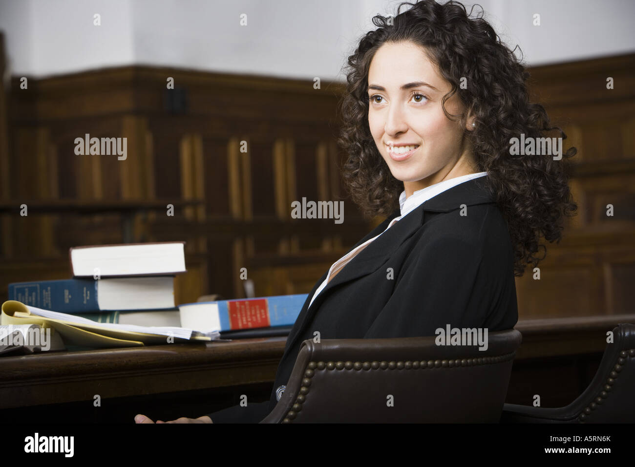 Female lawyer smiling in courtroom Stock Photo - Alamy