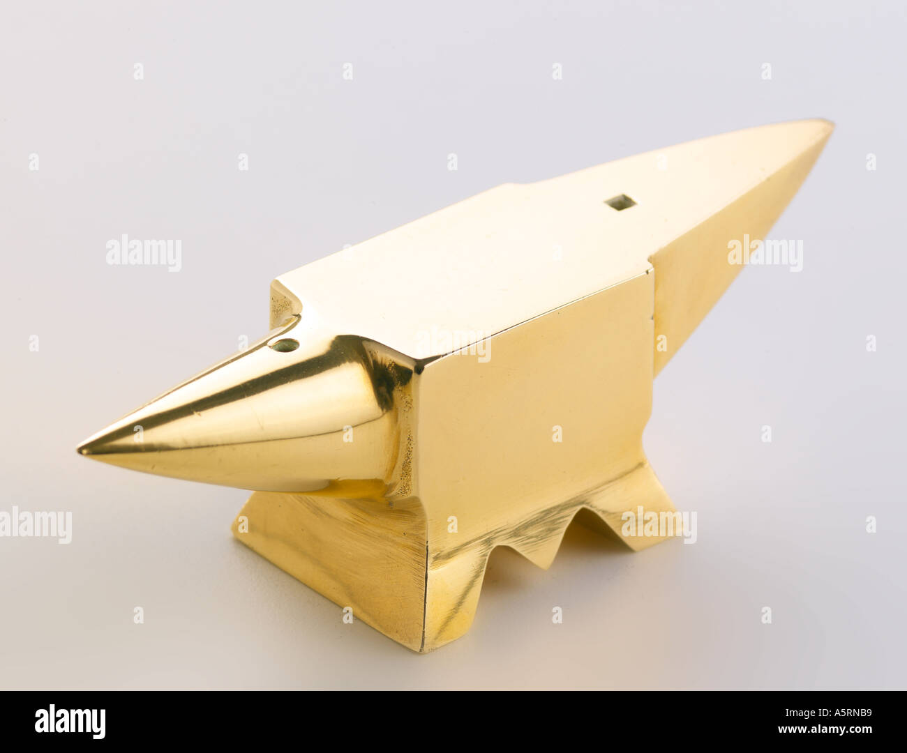 little gold anvil Stock Photo - Alamy