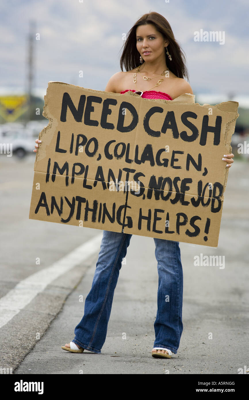 Woman standing on side of road soliciting cash Stock Photo - Alamy