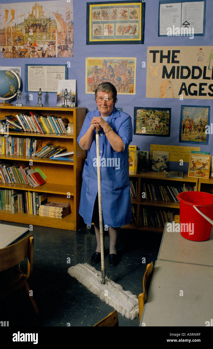 CLEANING WOMAN IN CLASSROOM Stock Photo - Alamy