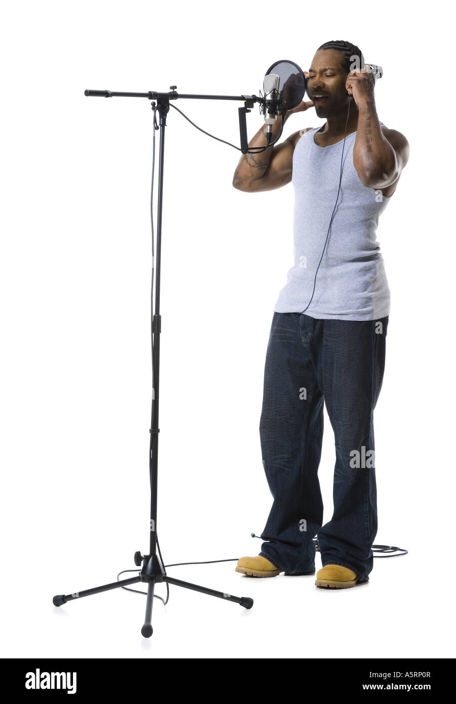 African American man singing into microphone Stock Photo - Alamy