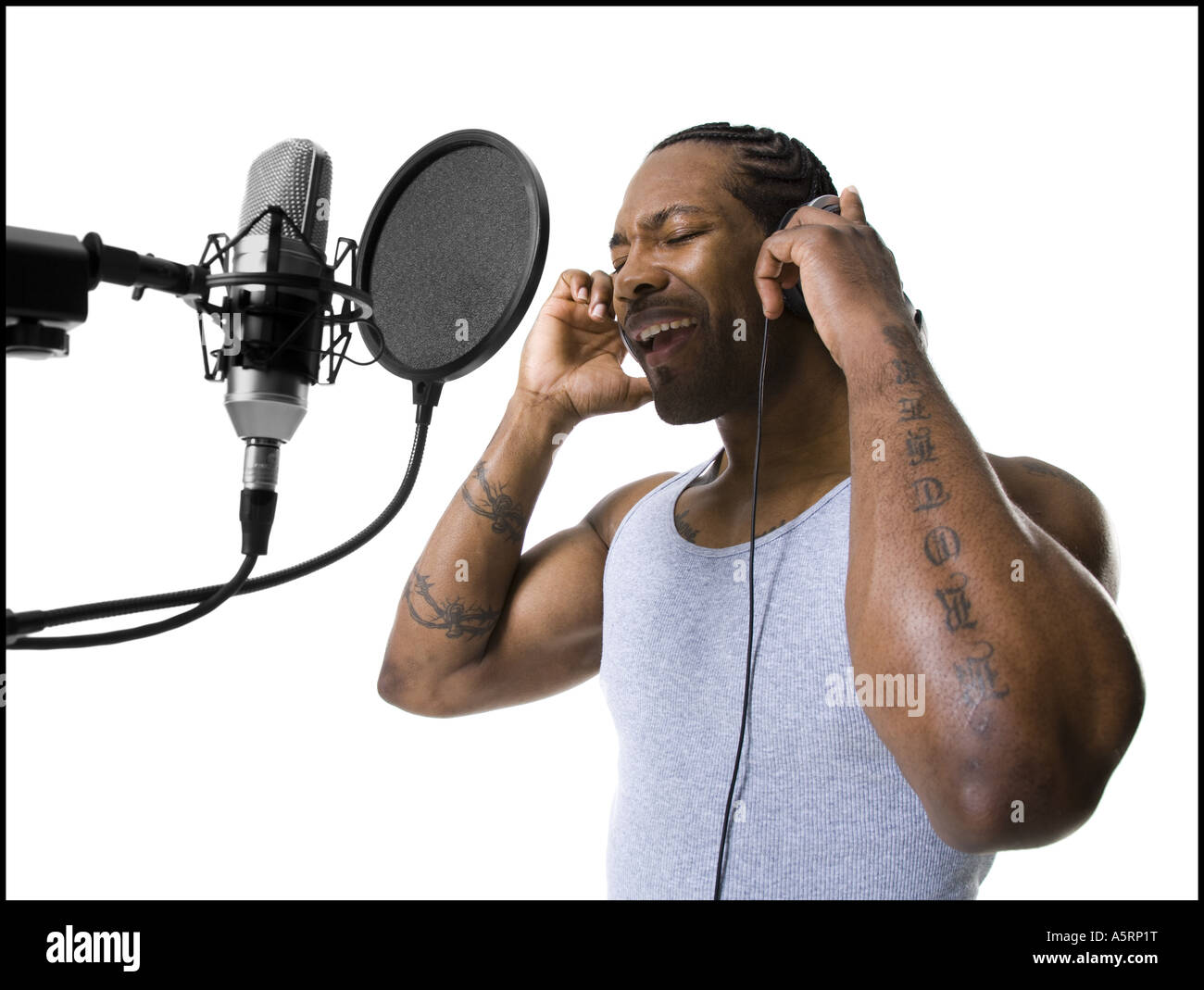 African American man singing into microphone Stock Photo - Alamy