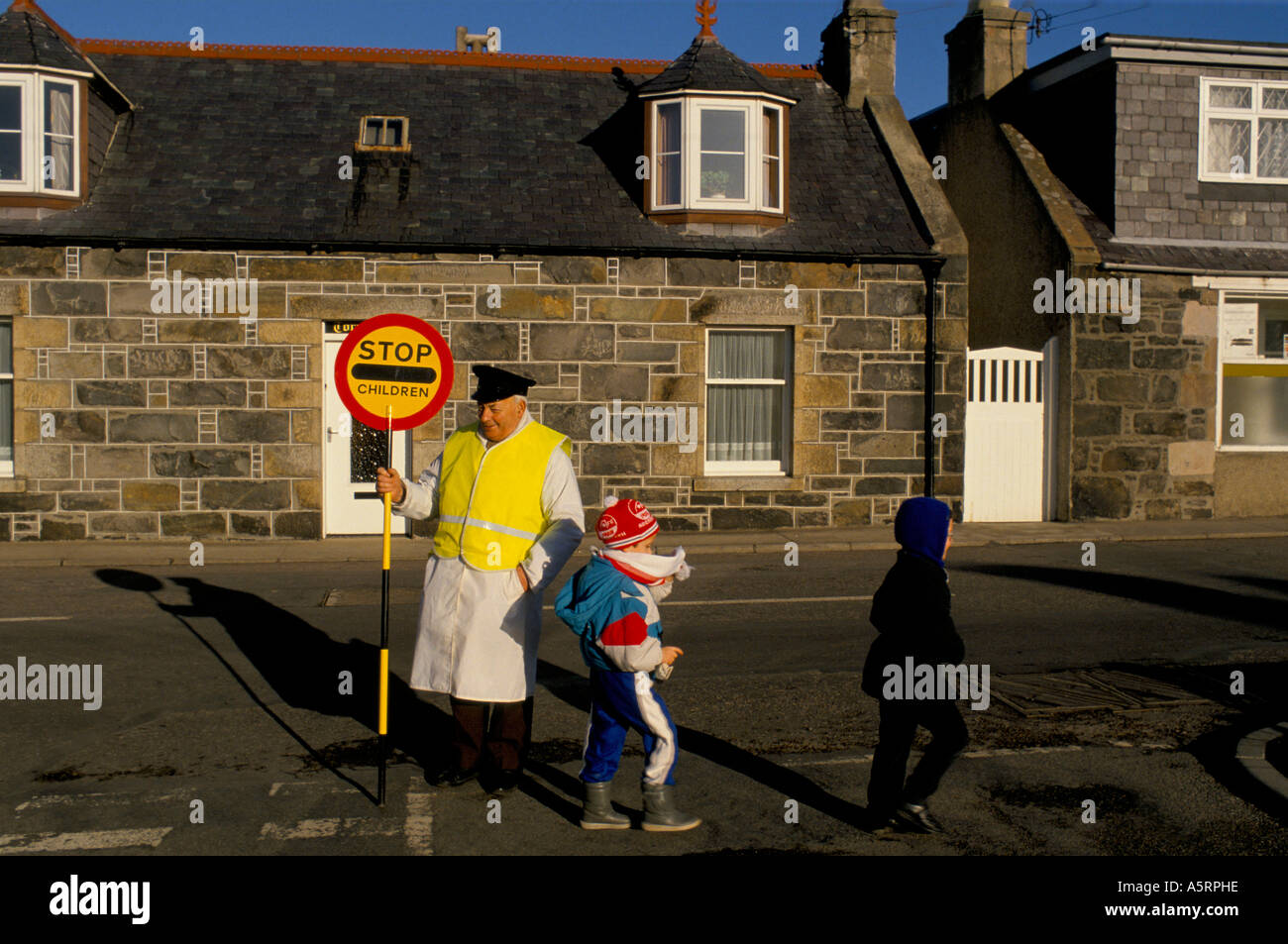 Helping across road hi-res stock photography and images - Alamy