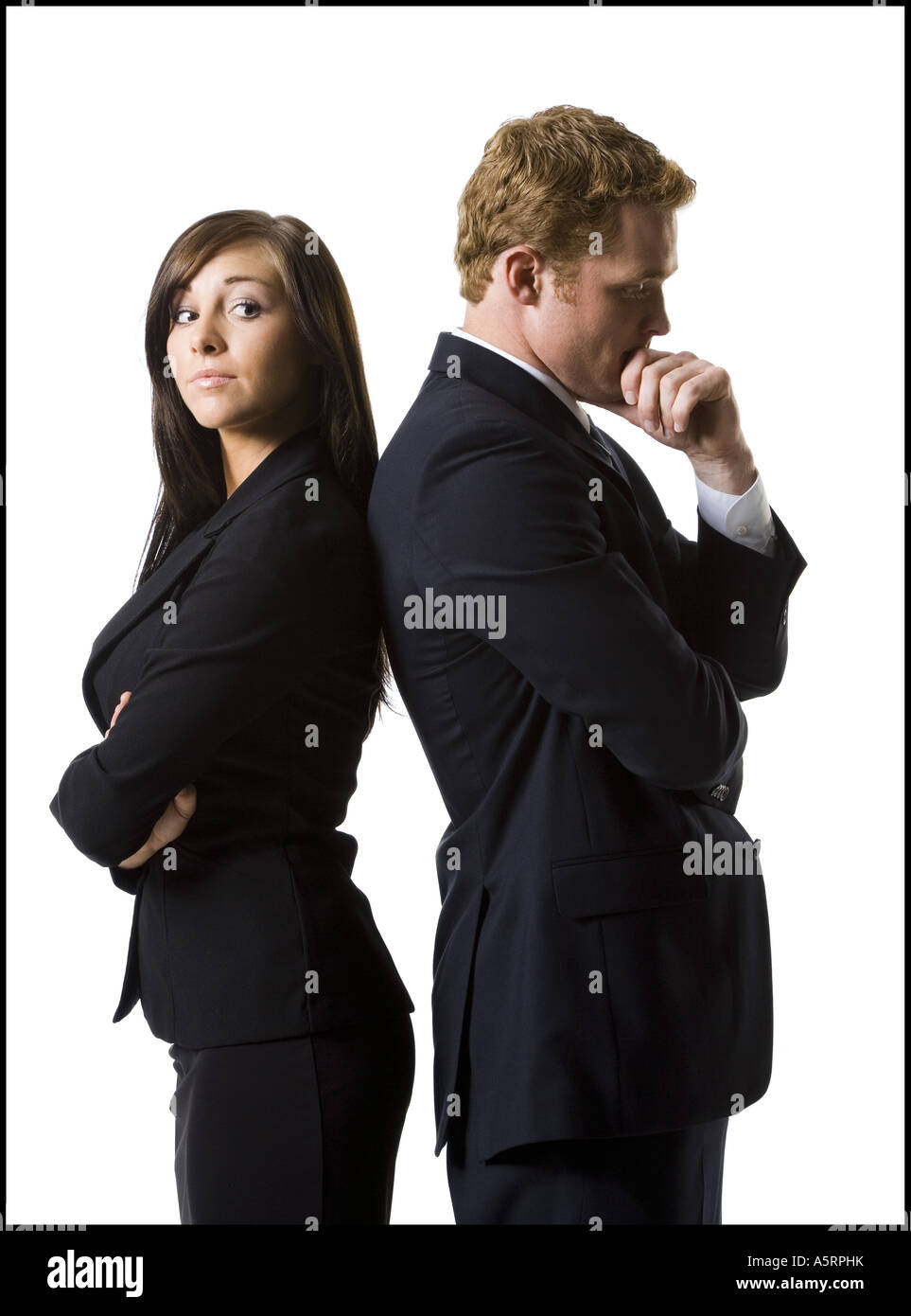 Businessman and businesswoman standing back to back Stock Photo - Alamy