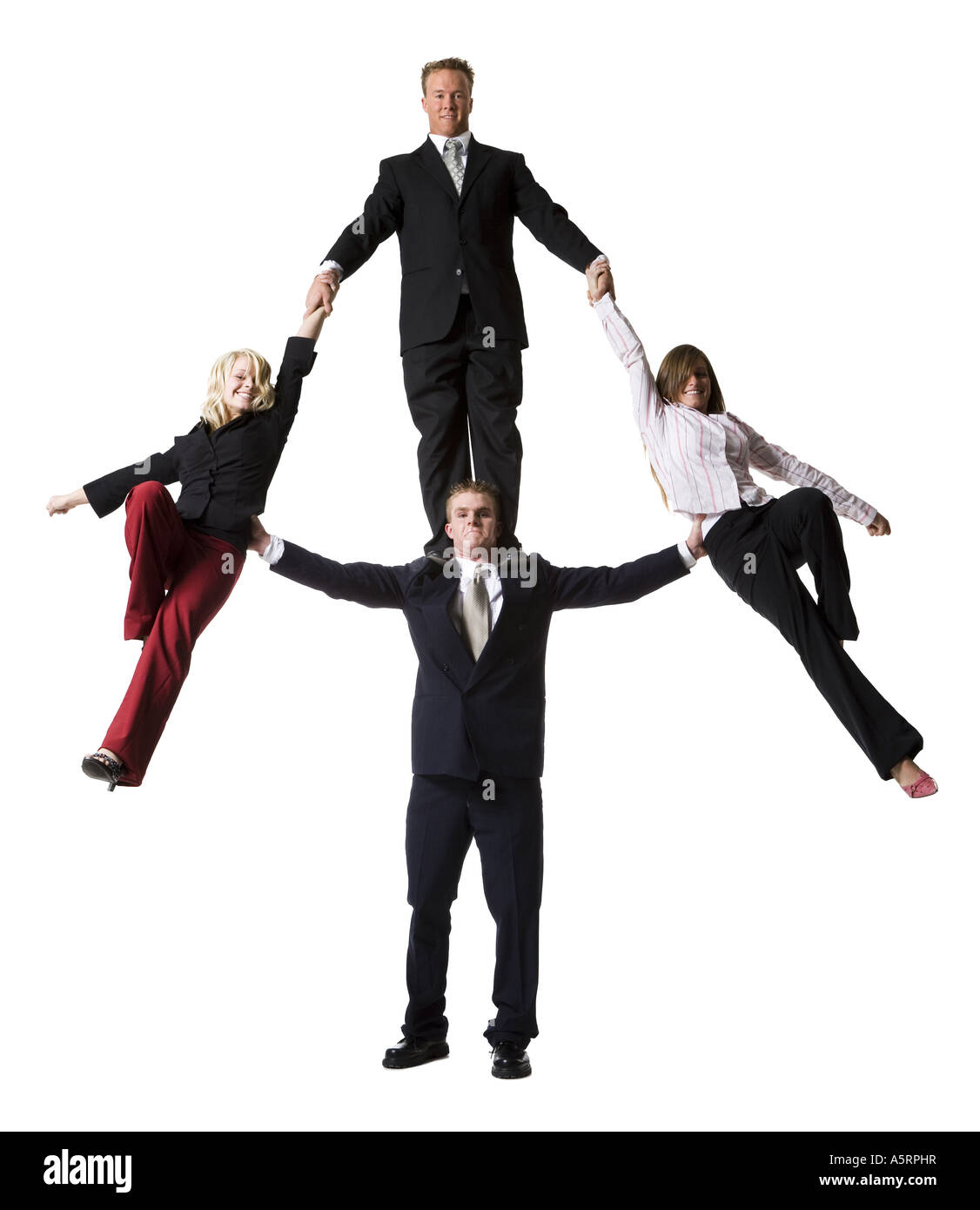 Business people creating a human pyramid Stock Photo - Alamy