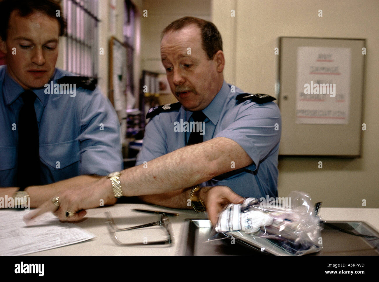 GREATER MANCHESTER POLICE IN SALFORD DUTY SERGEANT CHECKING OUT ...
