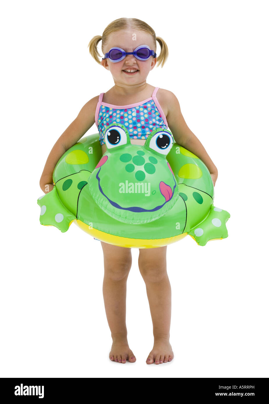 Young girl with inflatable flotation device around waist Stock Photo ...