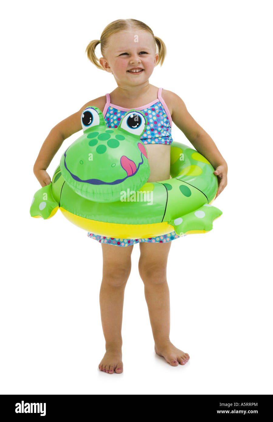 Young girl with inflatable flotation device around waist Stock Photo ...