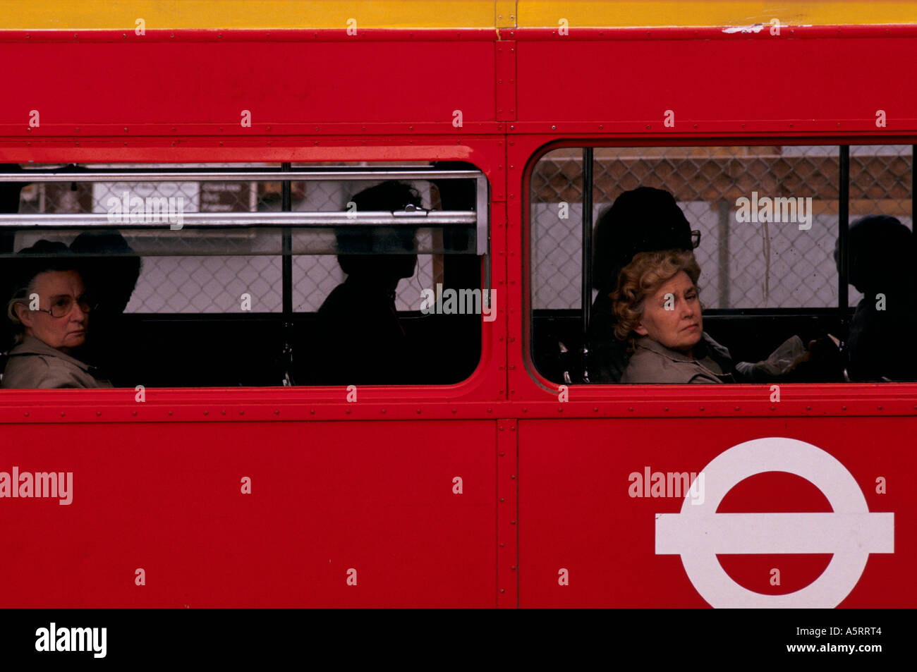 RED LONDON BUS WITH FEMALE PASSENGER Stock Photo - Alamy