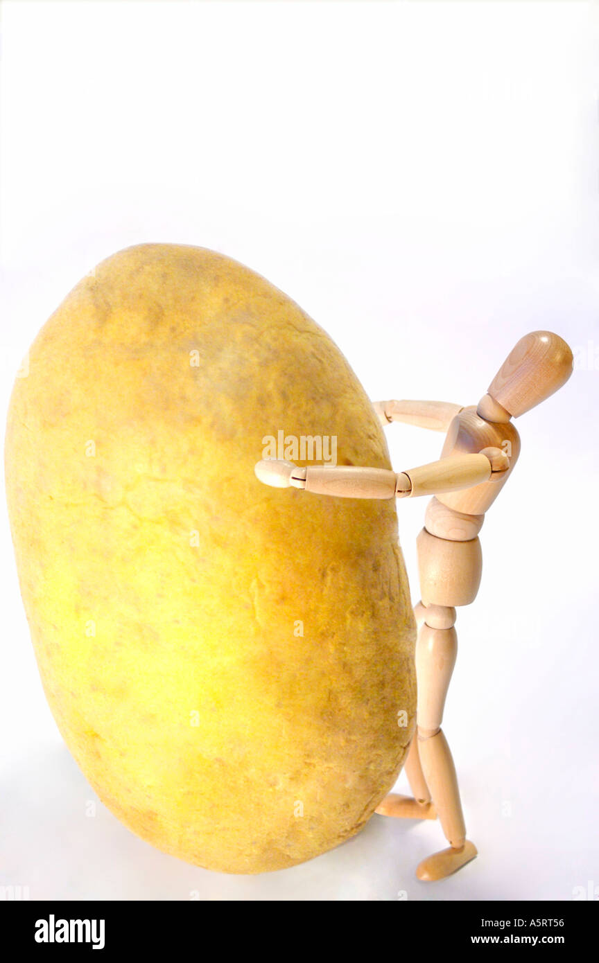 Wood Puppet with a big Potato Stock Photo - Alamy
