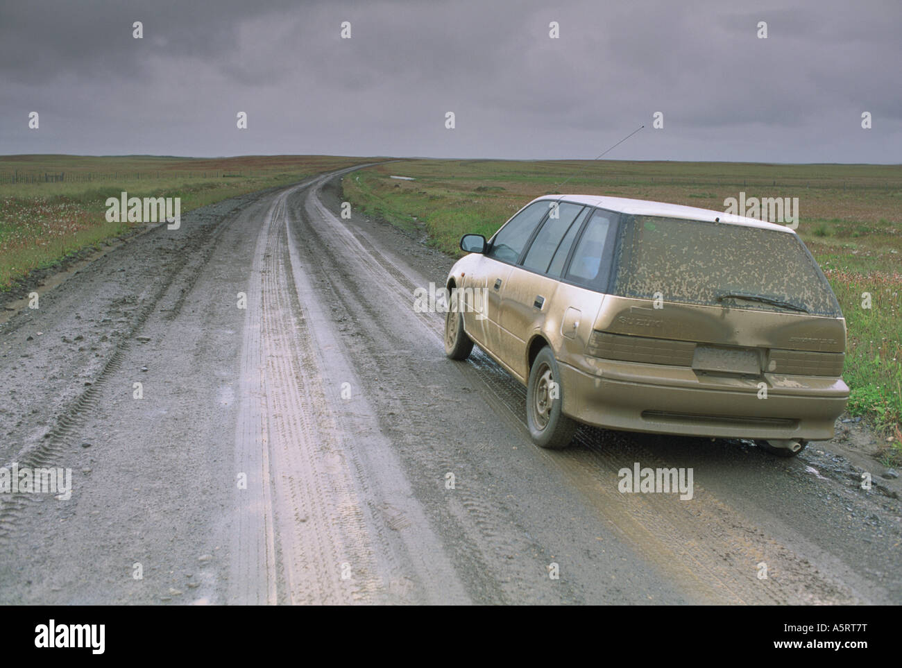 Muddy car on dirt road during rain storm Tierra del Fuego Chile Stock ...